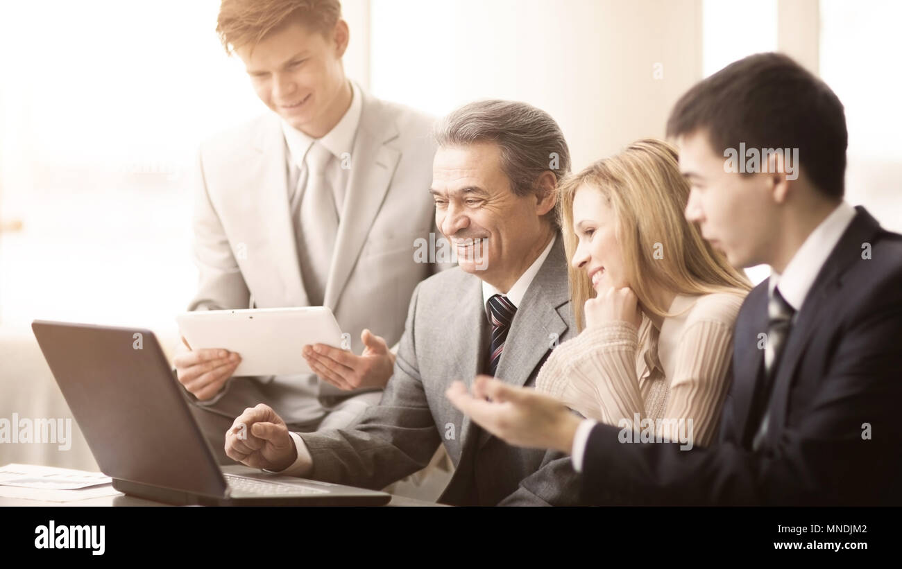 serious business team with tablet computers, documents having ...