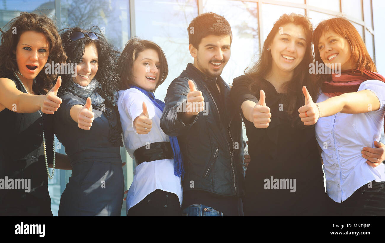 group of college students smiling friendly standing next to each other ...