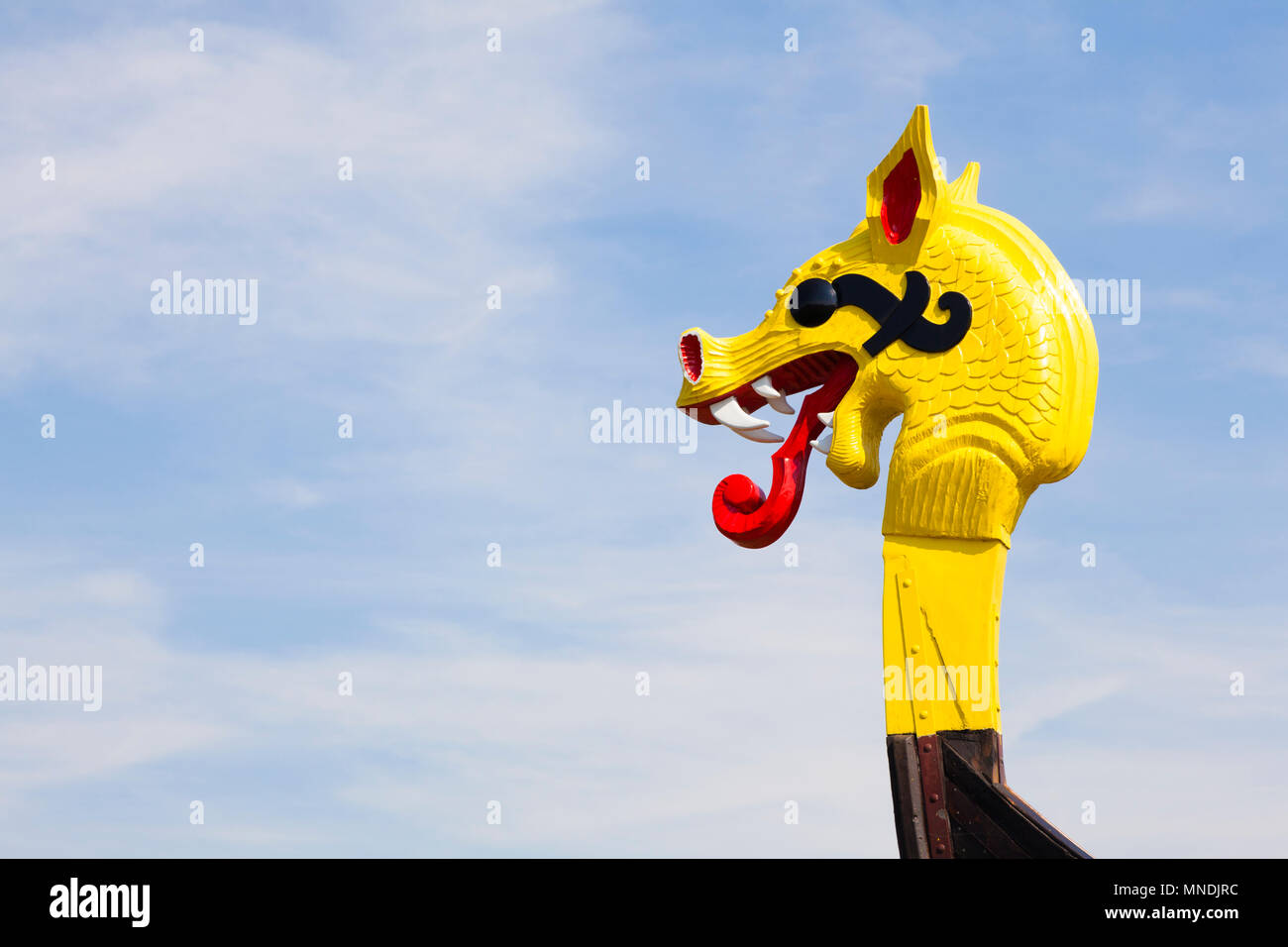 The dragon shaped figurehead on the prow of the Hugin, a replica of a ...