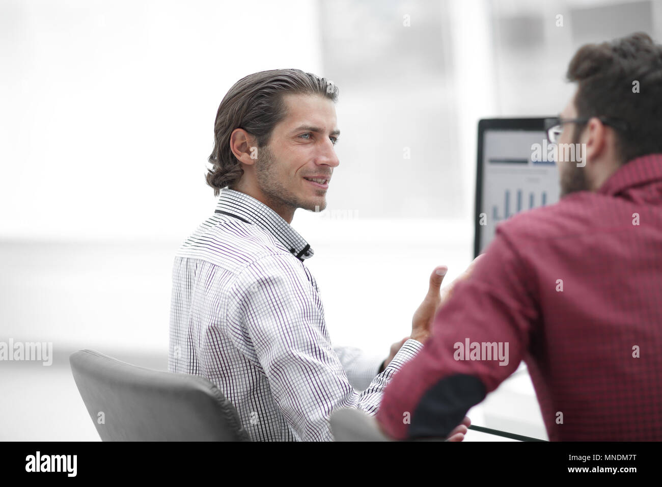 smiling employee talking with a colleague Stock Photo - Alamy