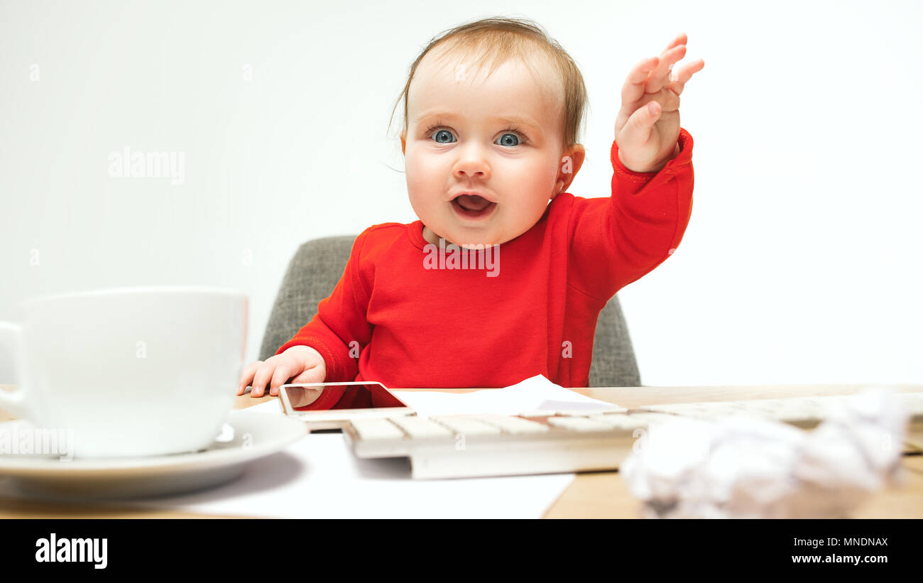 Happy child baby girl toddler sitting with keyboard of computer ...