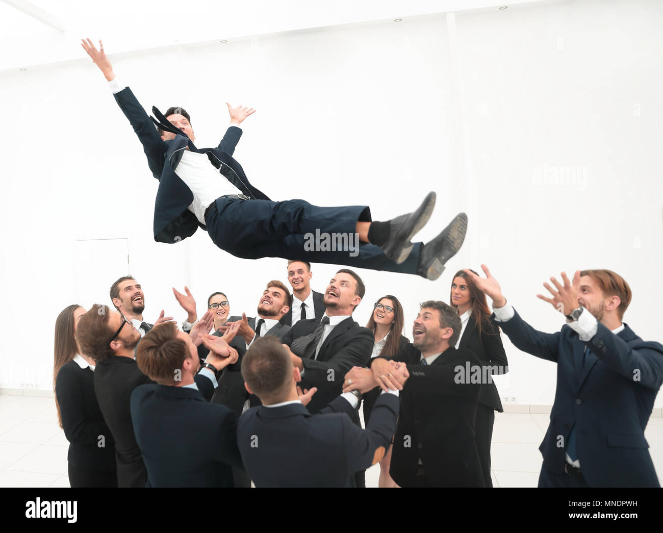 large business team rocking their leader Stock Photo - Alamy