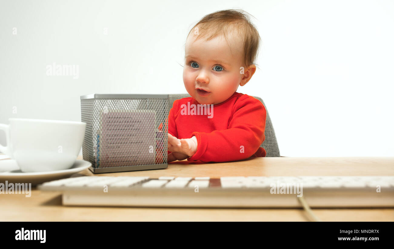 Happy child baby girl toddler sitting with keyboard of computer ...
