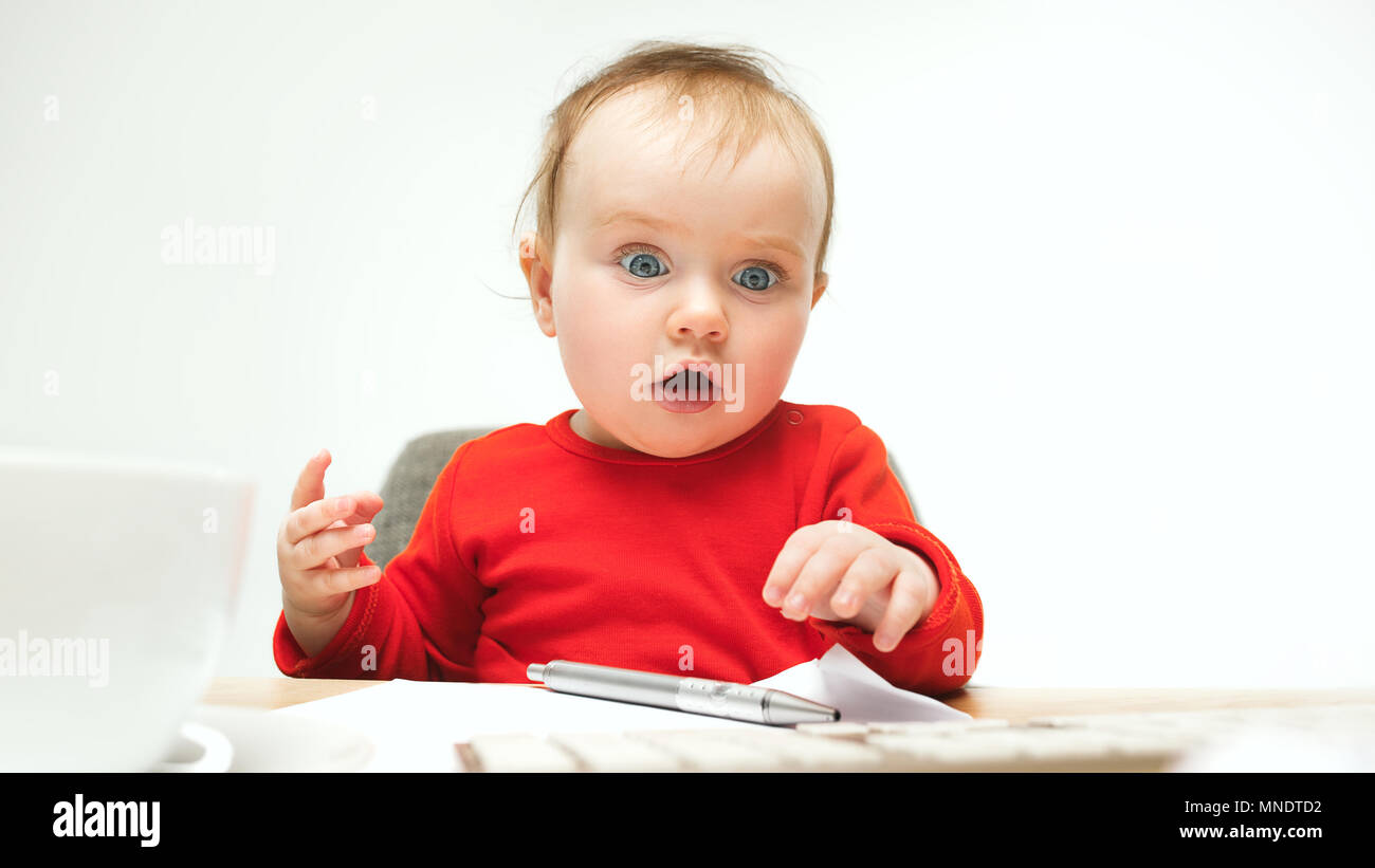 Happy child baby girl toddler sitting with keyboard of computer ...