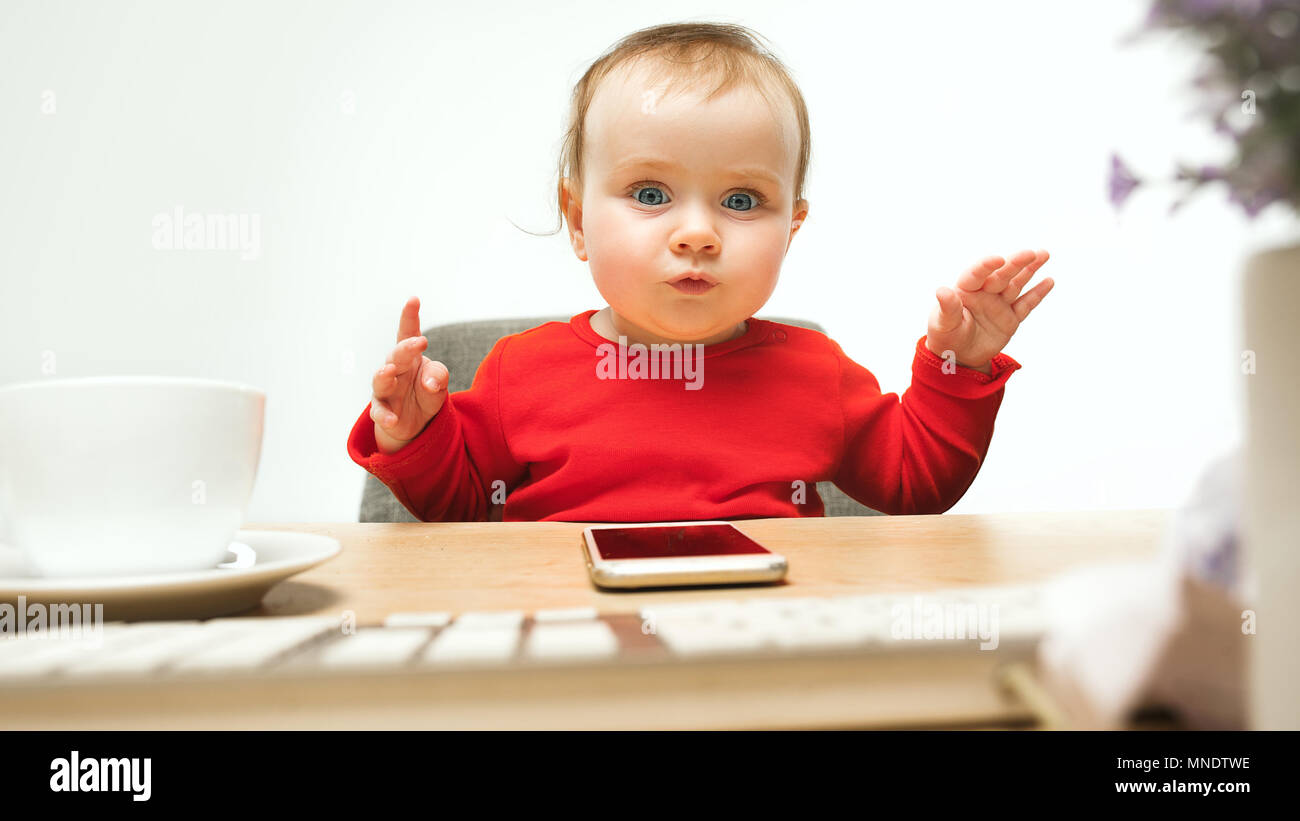 Happy child baby girl toddler sitting with keyboard of computer ...