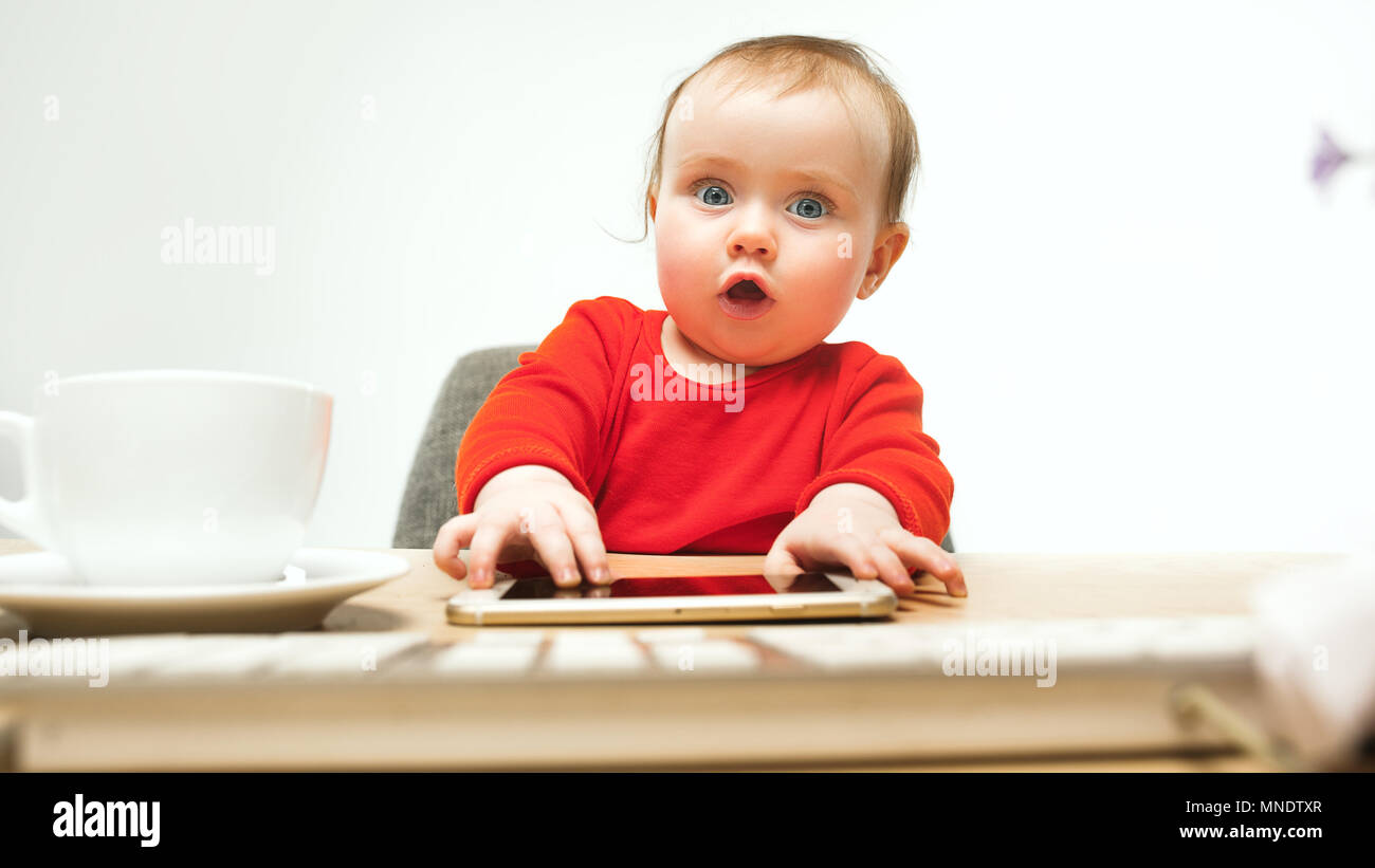 Happy child baby girl toddler sitting with keyboard of computer ...