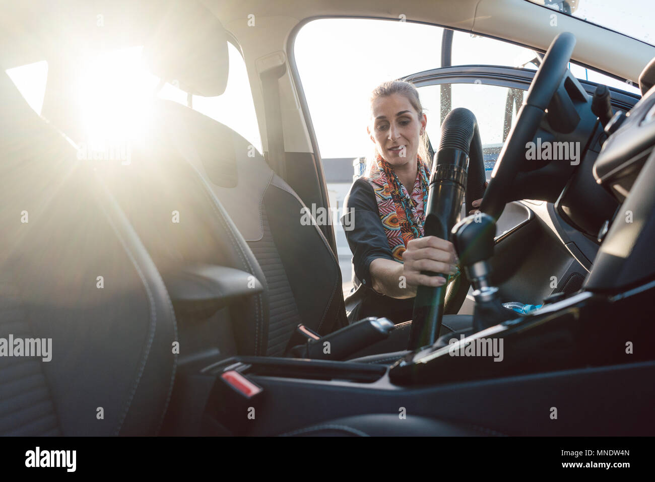 Woman cleaning inside car hi-res stock photography and images - Alamy