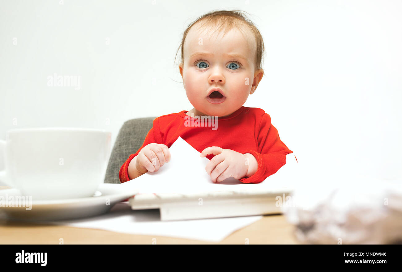 Happy child baby girl toddler sitting with keyboard of computer ...