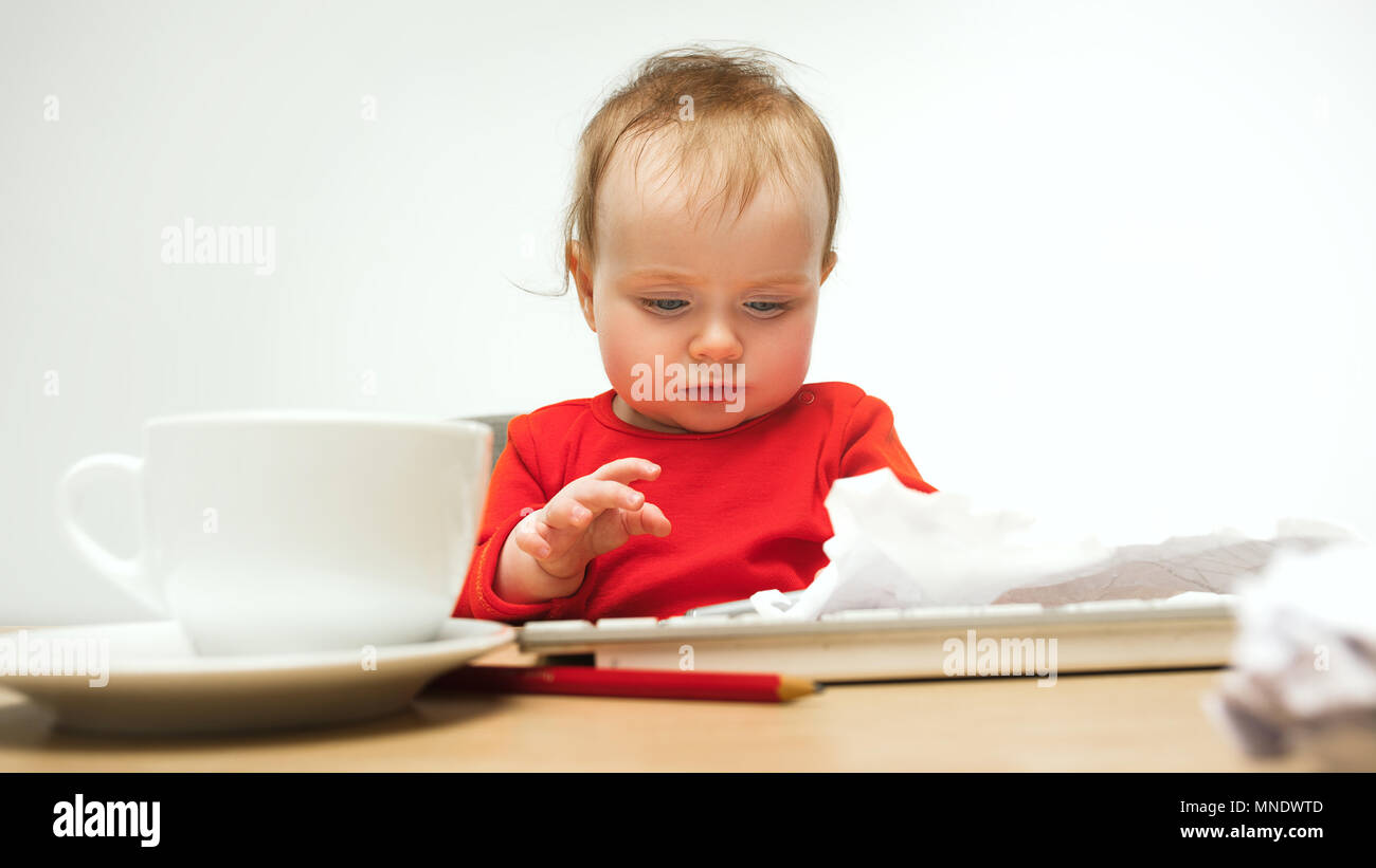 Happy child baby girl toddler sitting with keyboard of computer ...