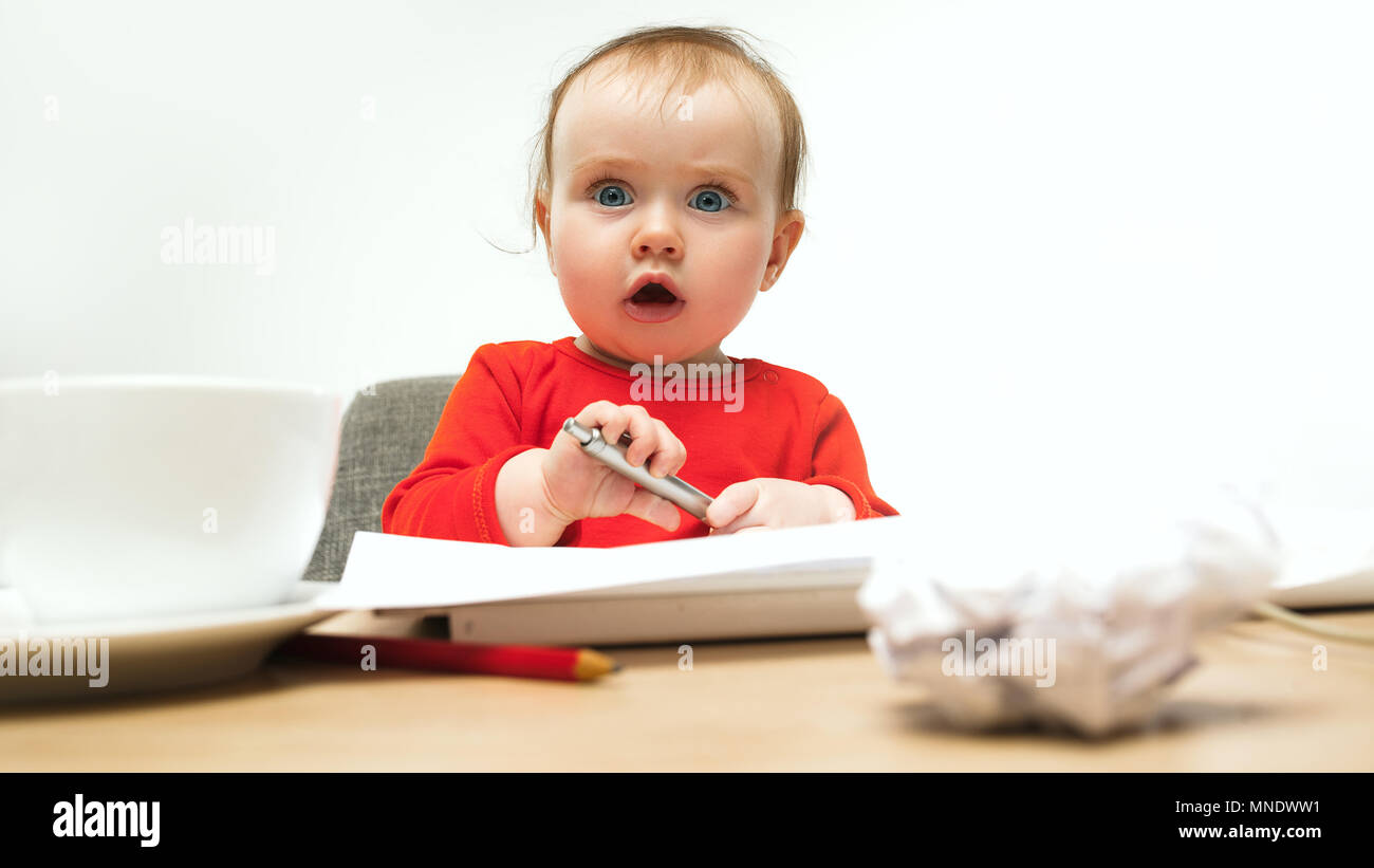 Happy child baby girl toddler sitting with keyboard of computer ...