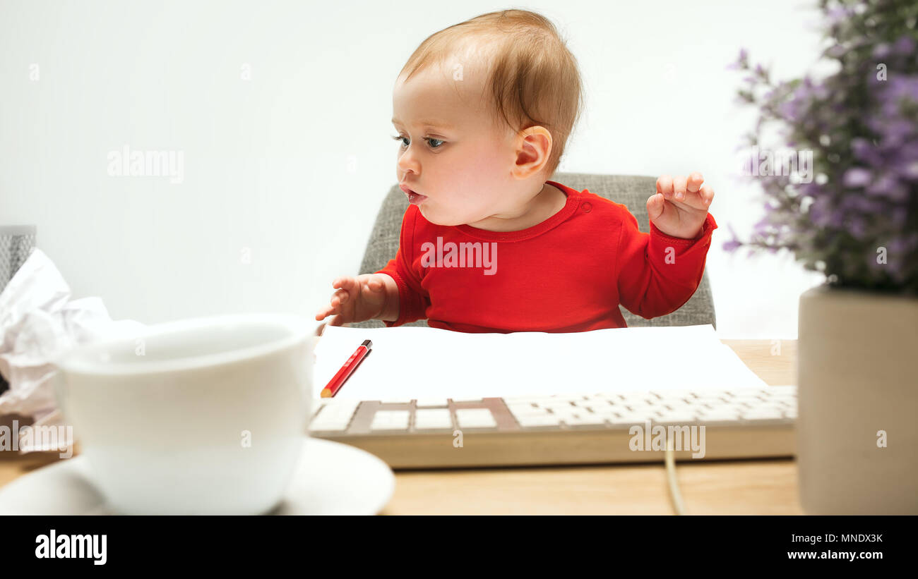 Happy child baby girl toddler sitting with keyboard of computer ...