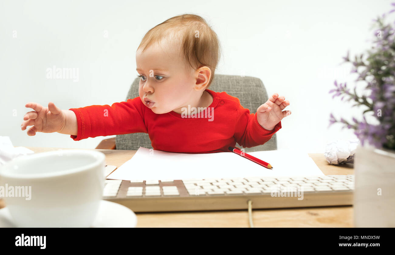 Happy child baby girl toddler sitting with keyboard of computer ...