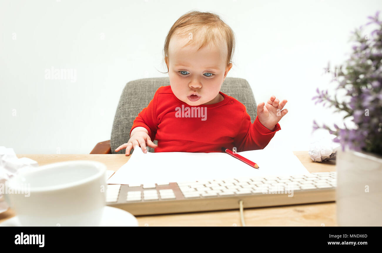 Happy child baby girl toddler sitting with keyboard of computer ...