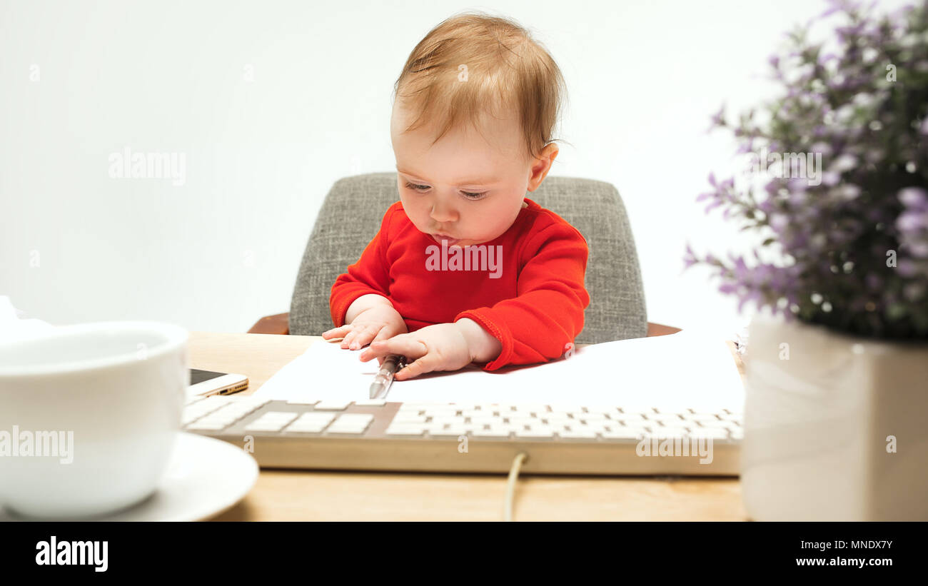 Happy child baby girl toddler sitting with keyboard of computer ...