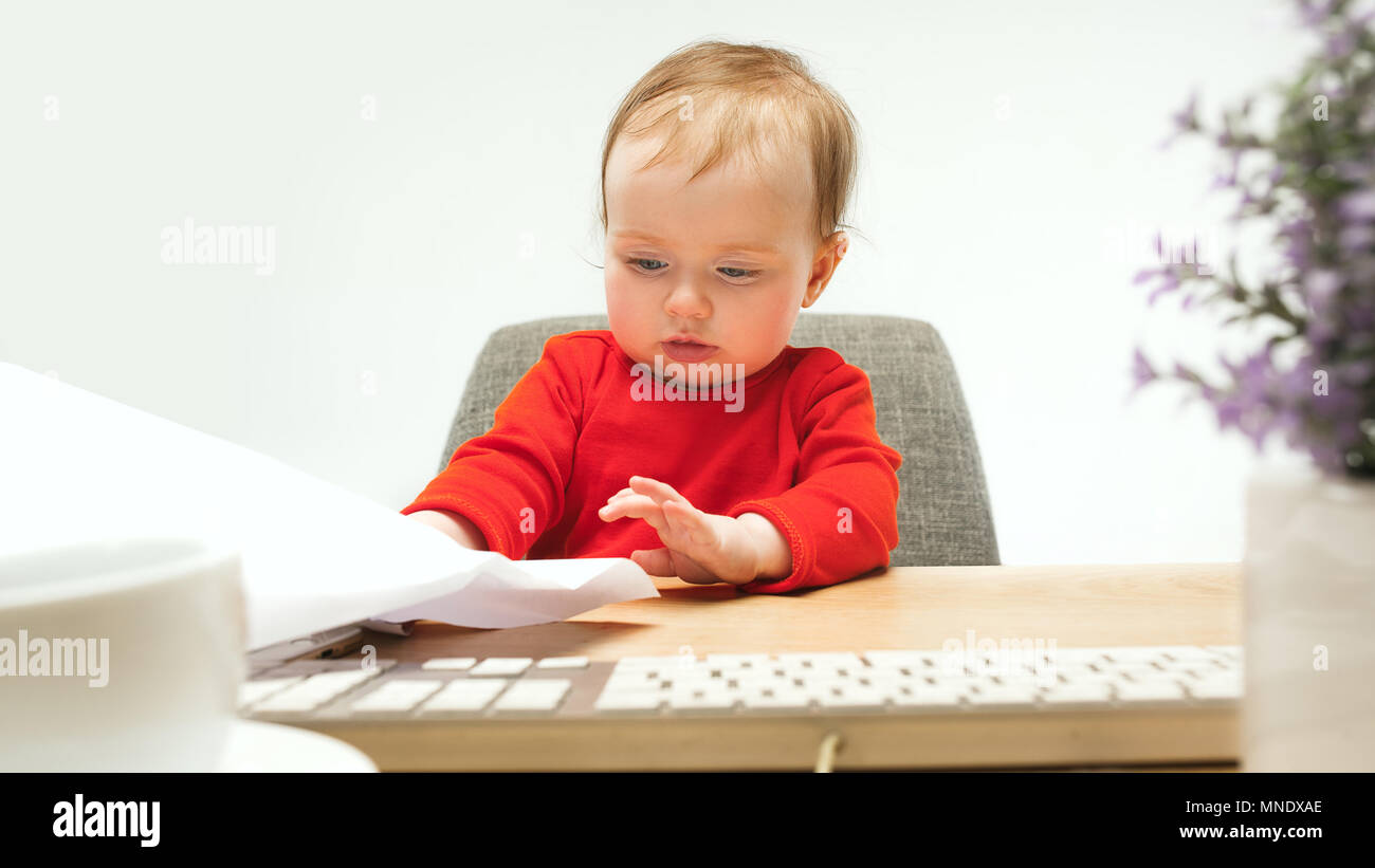 Happy child baby girl toddler sitting with keyboard of computer ...