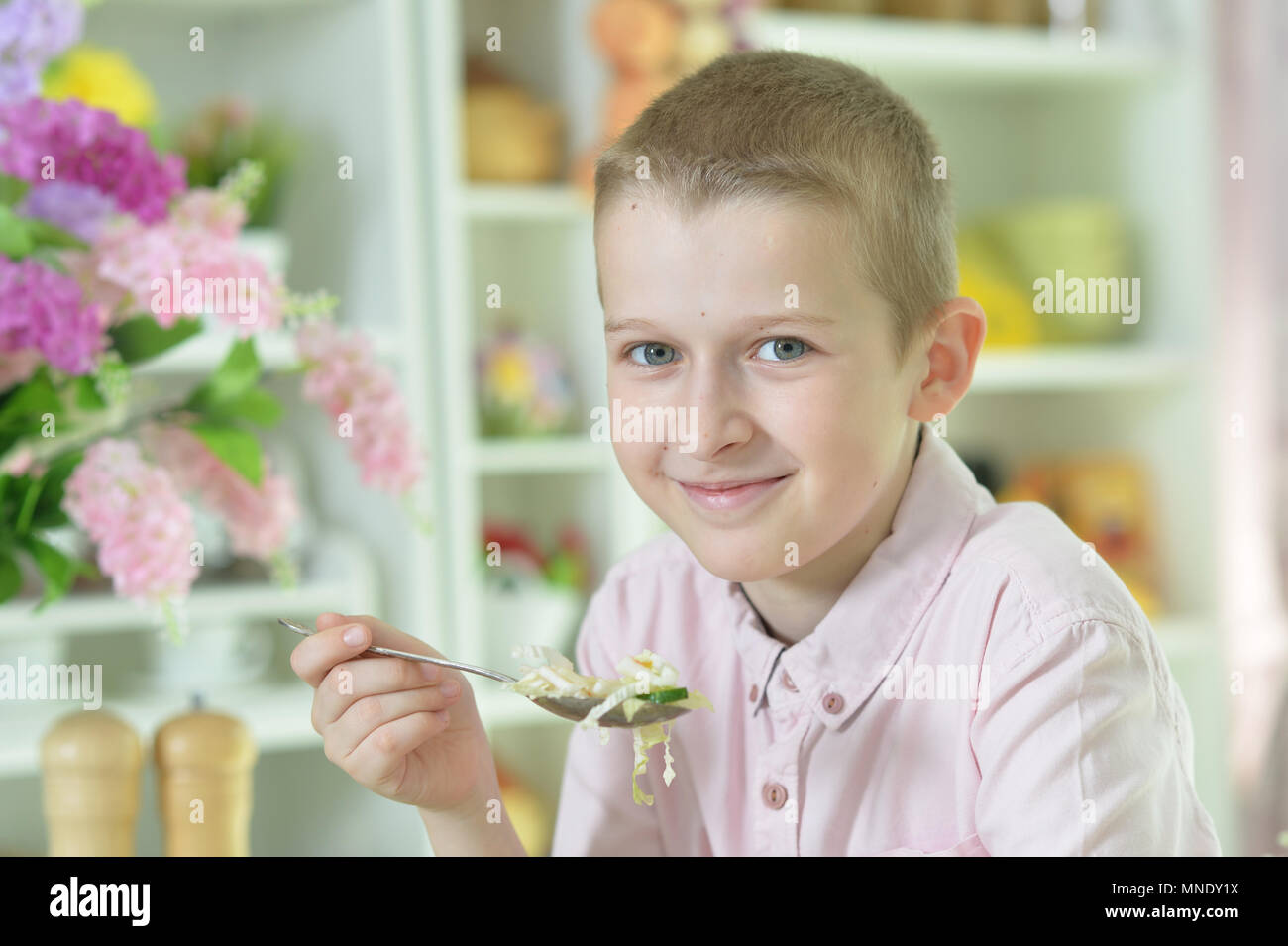 Cute little boy making dinner Stock Photo - Alamy