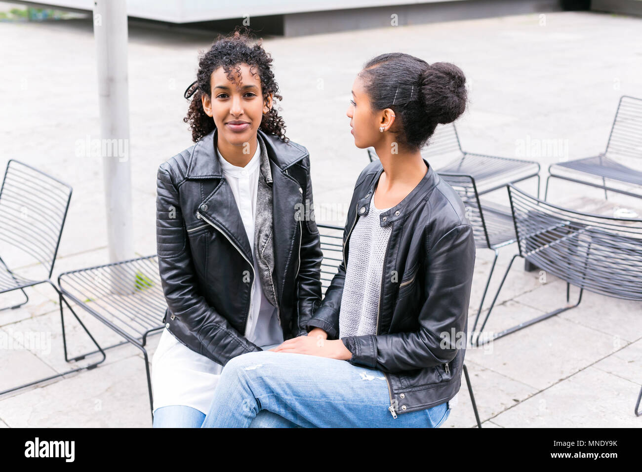 Two Girls Whispering Park High Resolution Stock Photography and Images ...