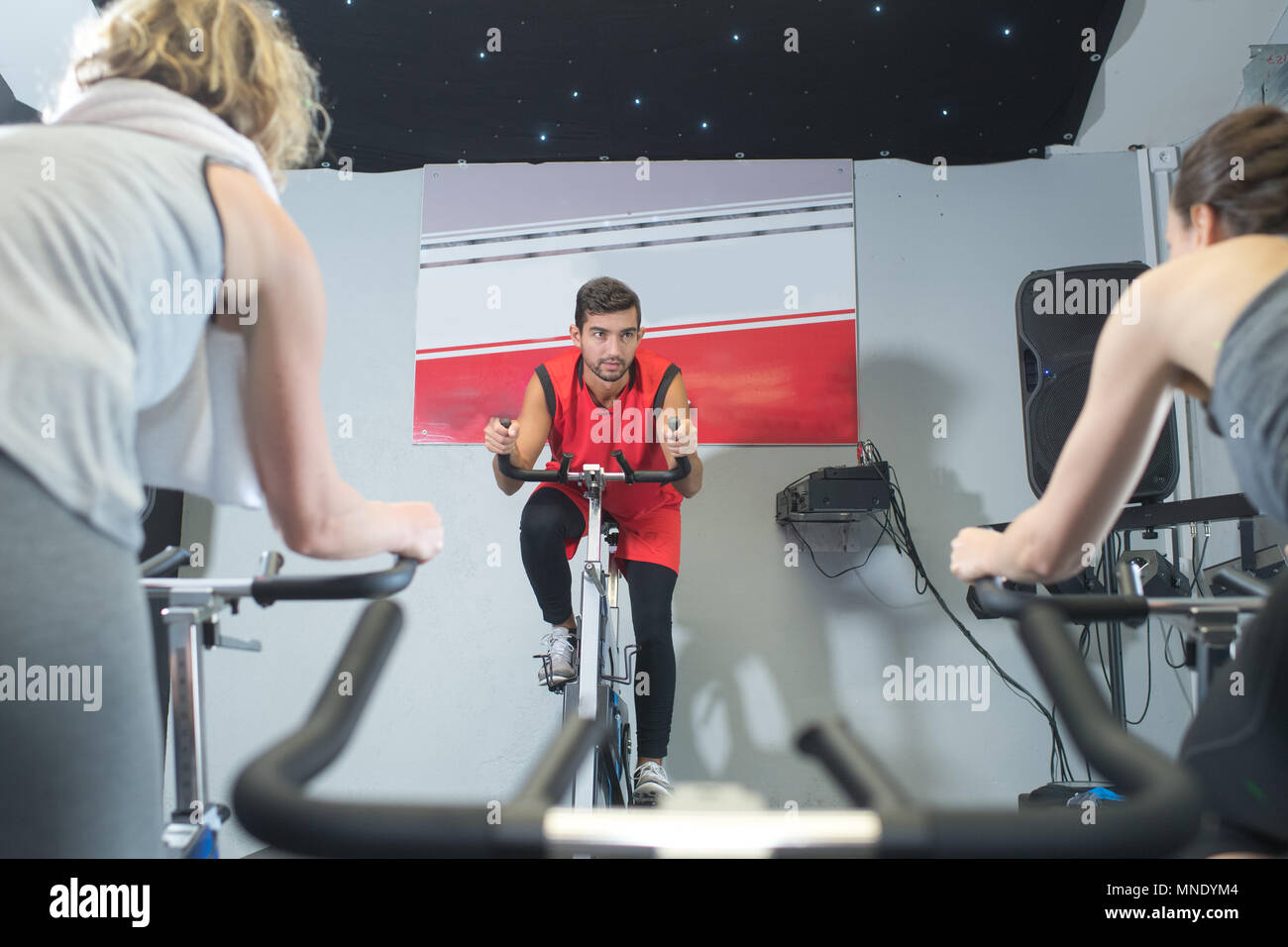 People training on static cycles Stock Photo - Alamy