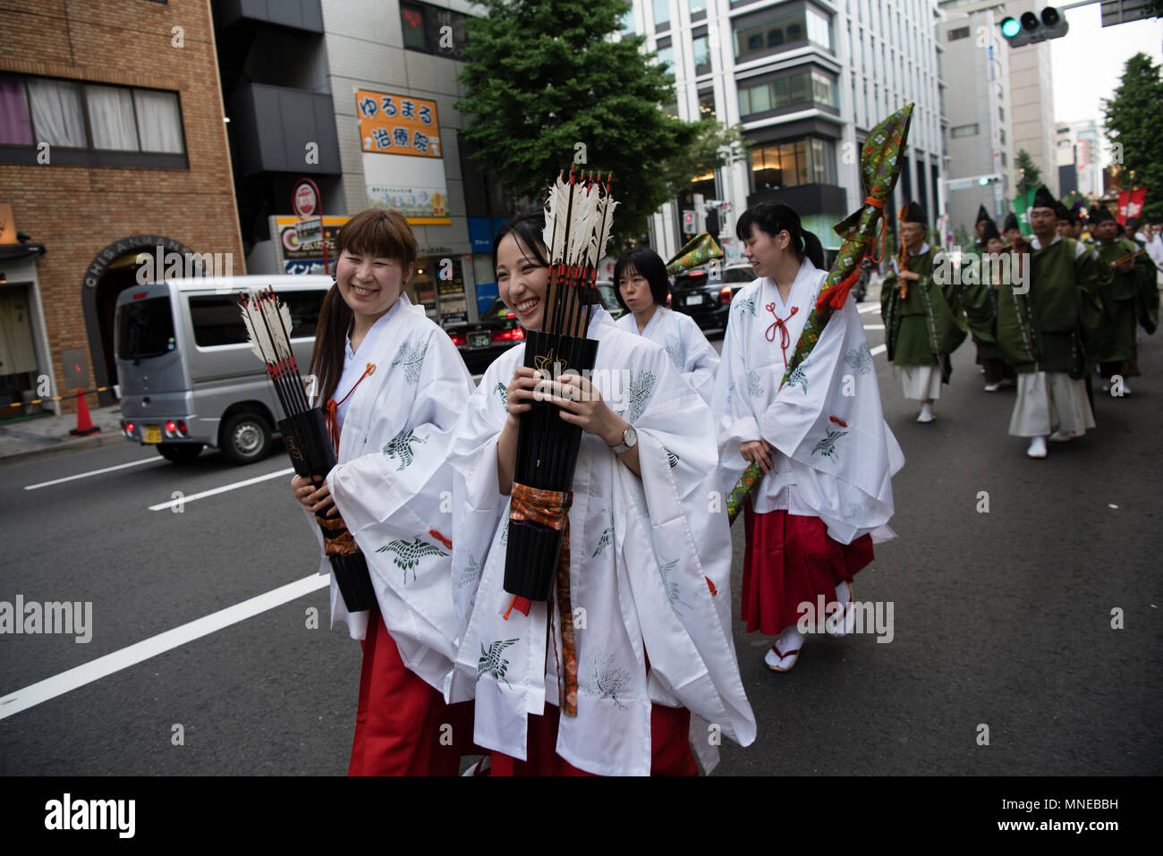 MAY 16, 2018 - Women carry arrows, a Shinto talisman, during the ...