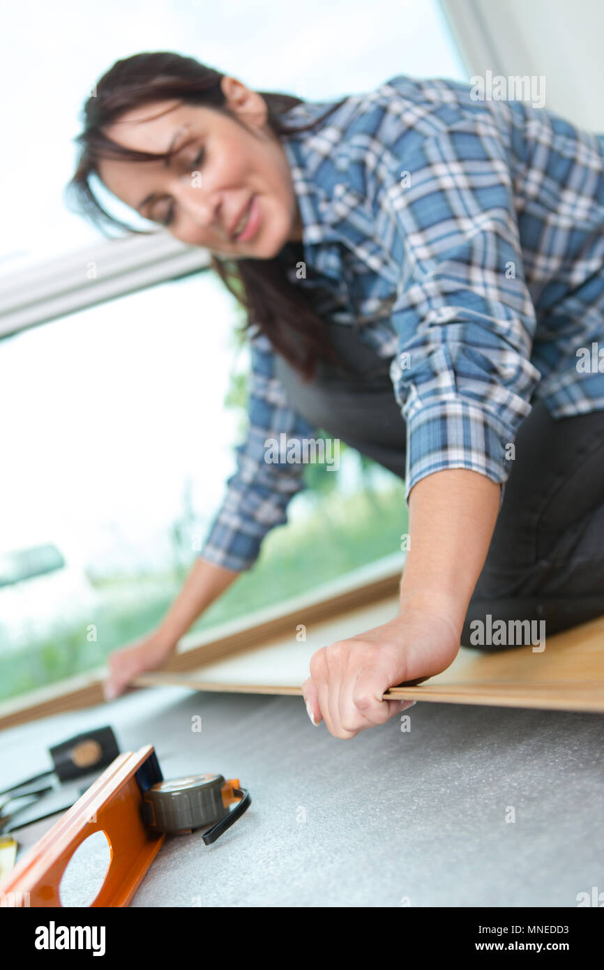 Woman laying laminate hi-res stock photography and images - Alamy