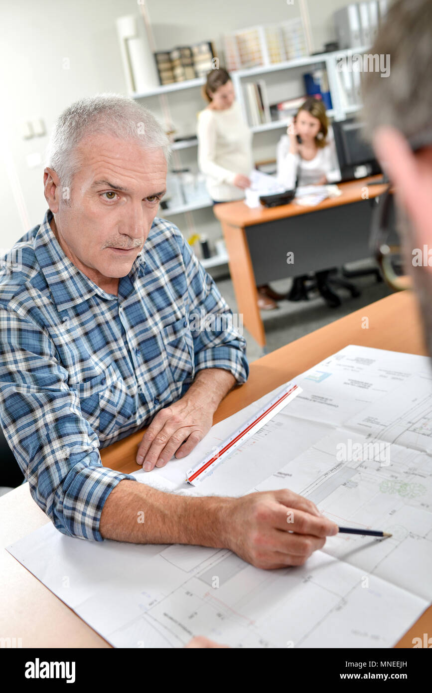 Architect explaining to client Stock Photo - Alamy