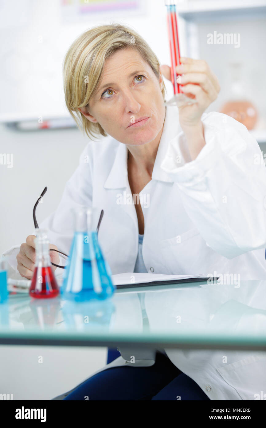 female researcher busy studying sapling in lab conditions Stock Photo ...