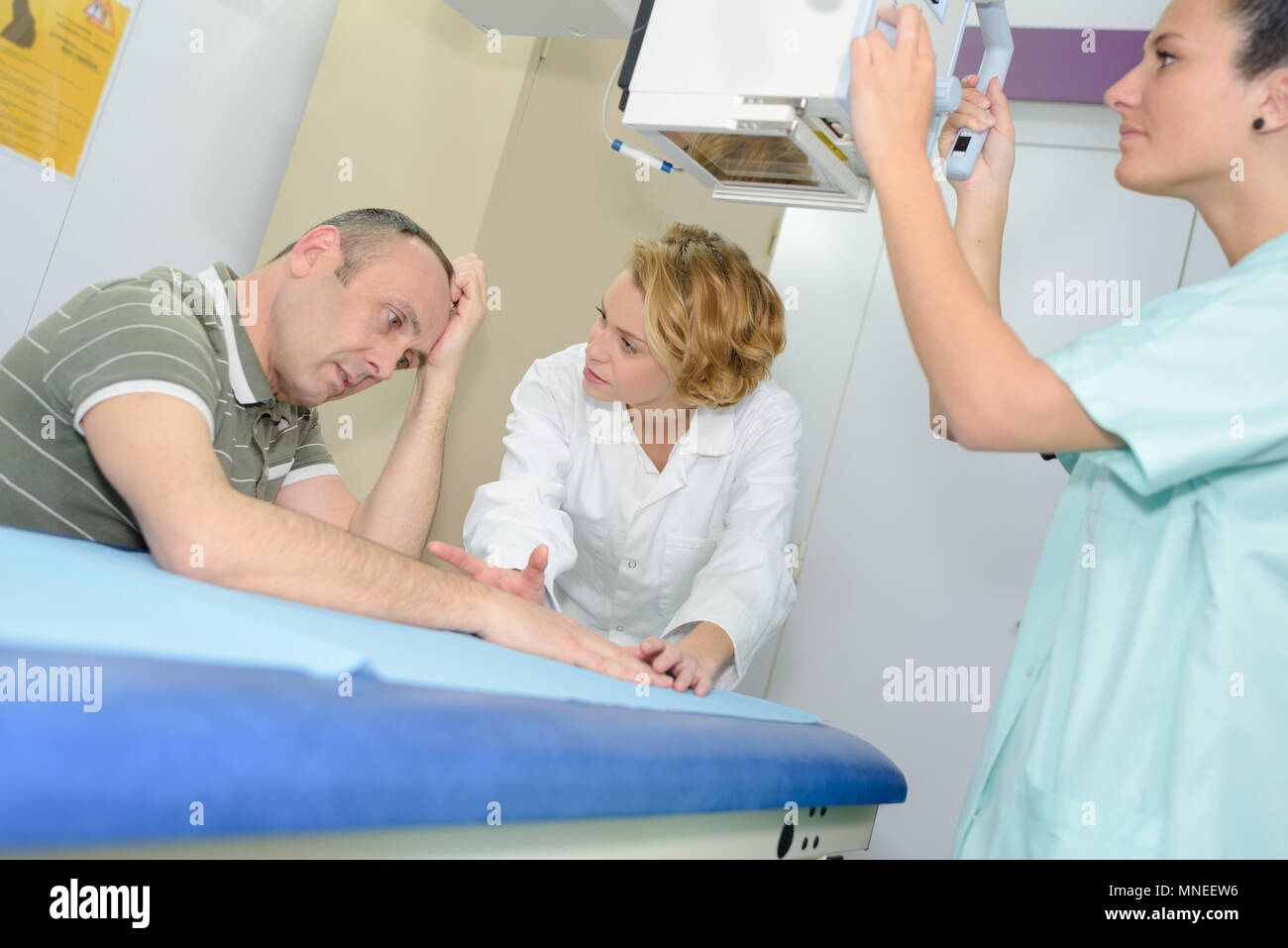 shocked man in clinic after a medicine report Stock Photo - Alamy