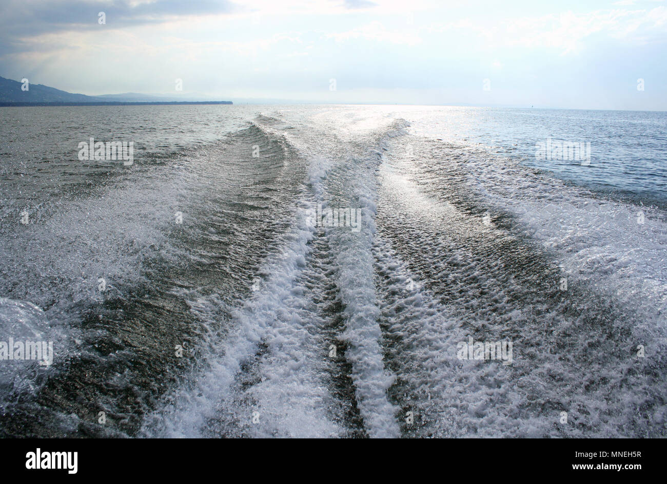 Wake behind the ferry, wild water behind the ship Stock Photo - Alamy