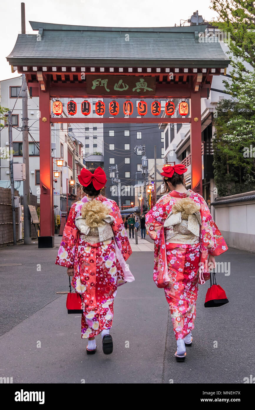 Geishas stroll through the Asakusa district in Tokyo, Japan Stock Photo ...