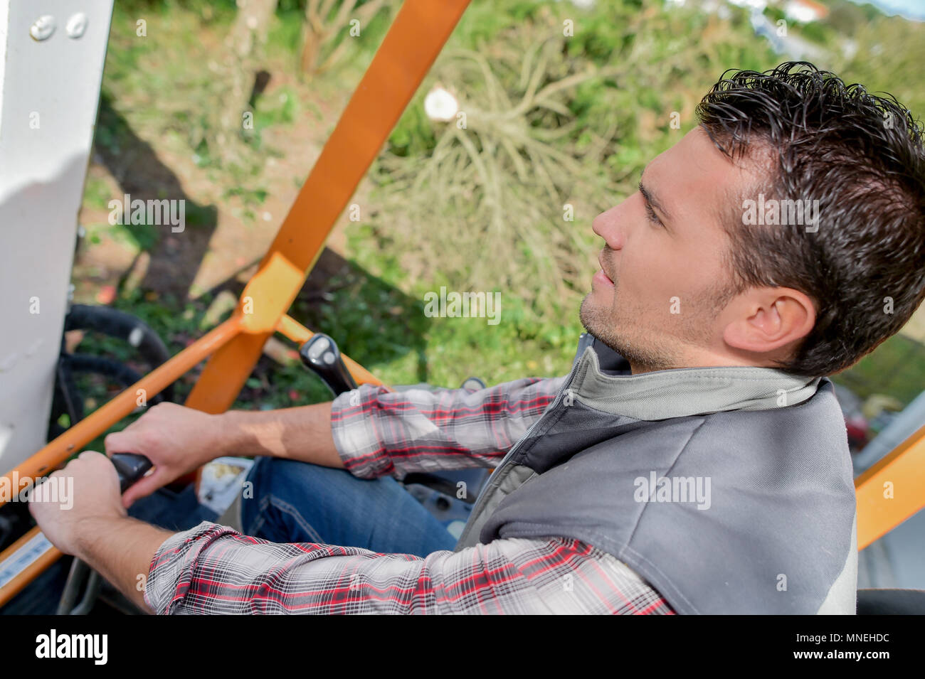 Worker operating powerful machine hi-res stock photography and images ...