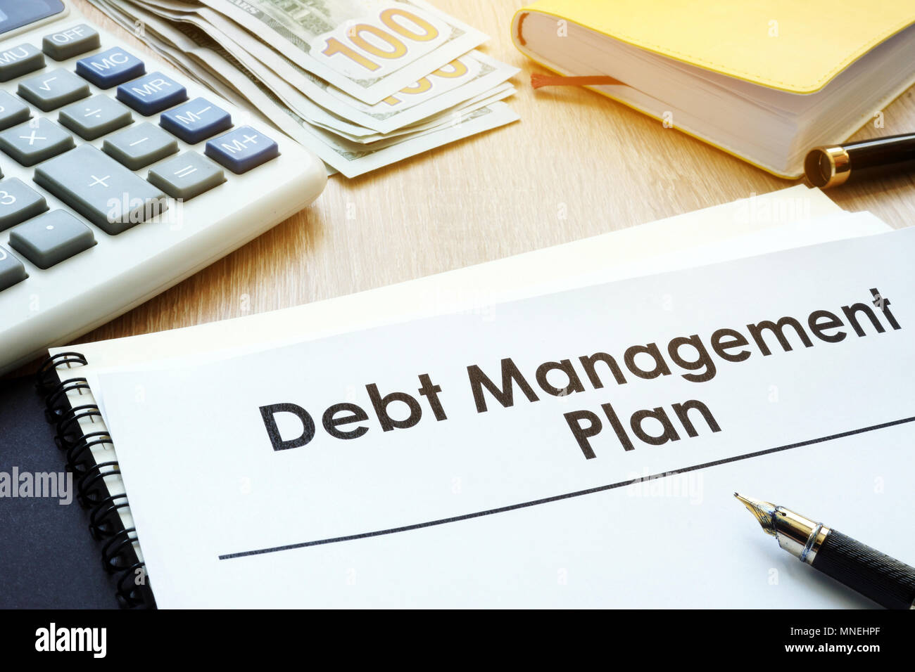 Debt Management Plan on a table Stock Photo - Alamy