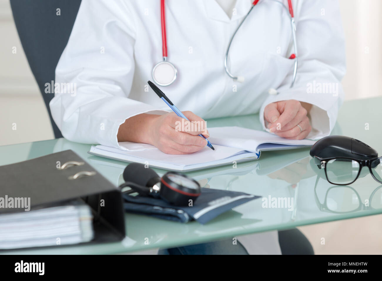 doctor writing notes Stock Photo - Alamy