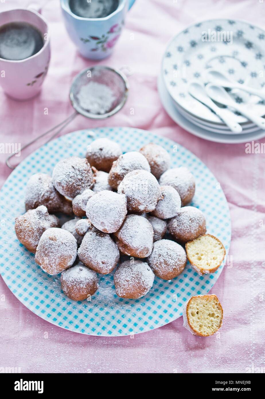 Mini doughnuts with icing sugar Stock Photo - Alamy