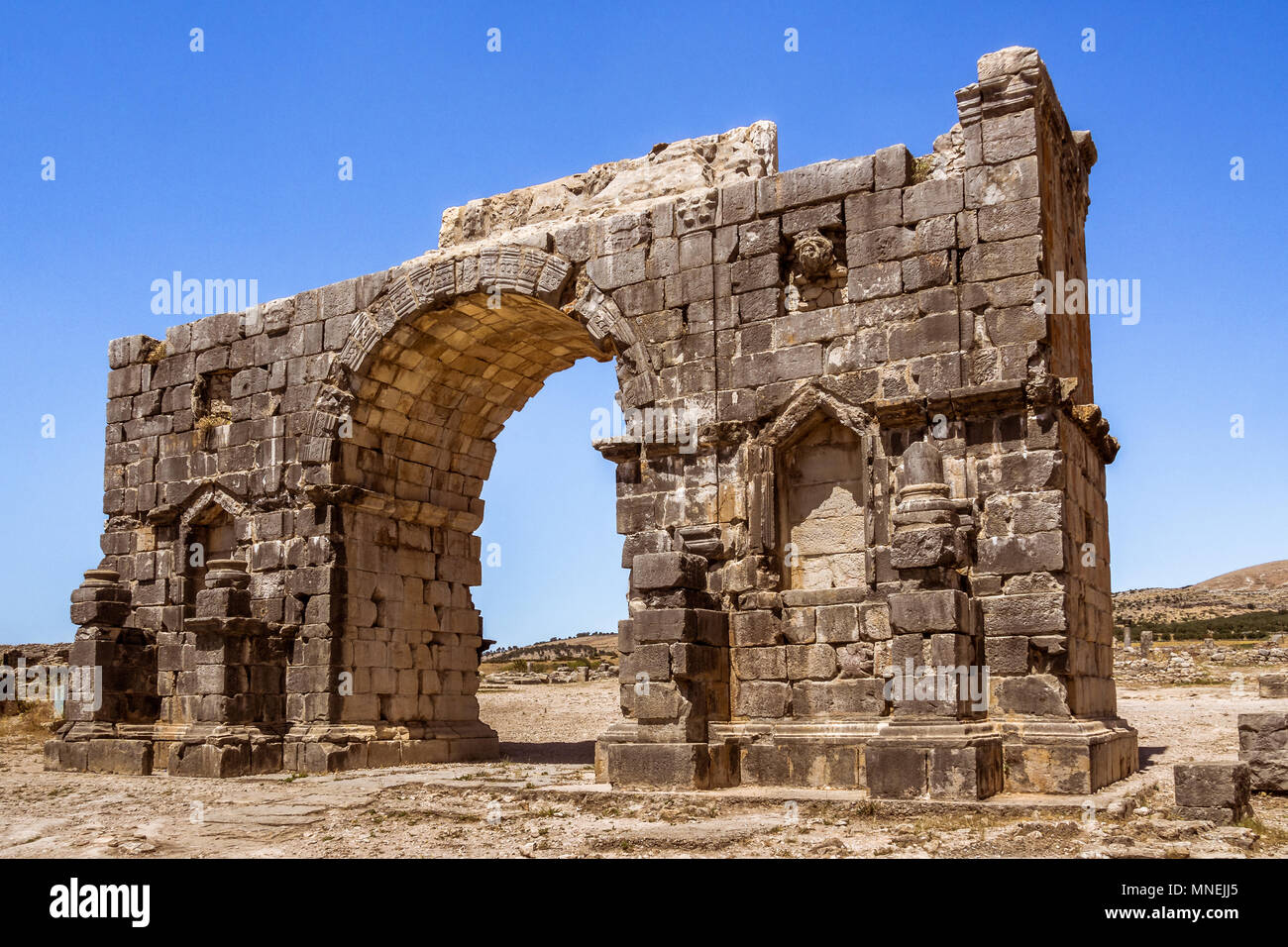 The Arch of Caracalla, the entrance gate of Volubilis site near Fez and ...
