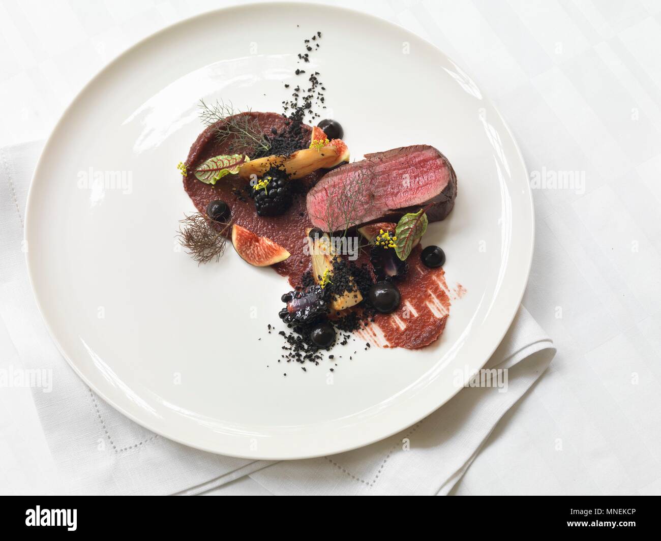 Venison fillet with figs and berries Stock Photo - Alamy