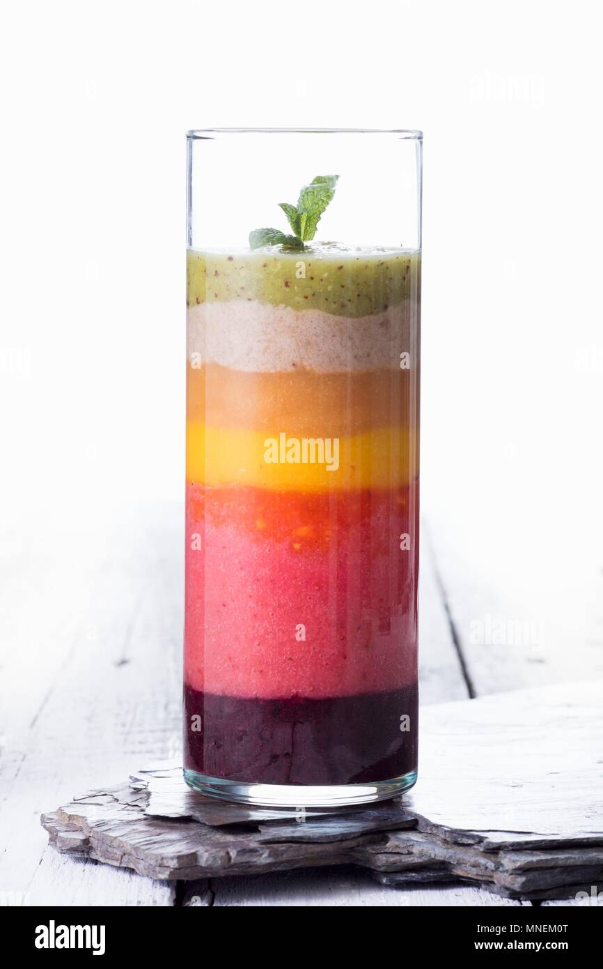 A colourful layered smoothie Stock Photo - Alamy