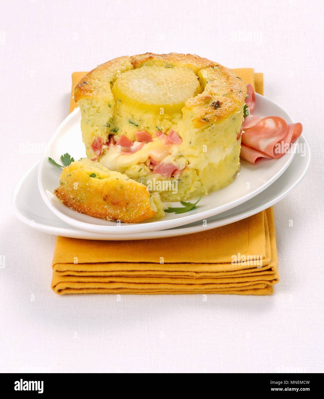 Italian potato flan with mortadella Stock Photo - Alamy