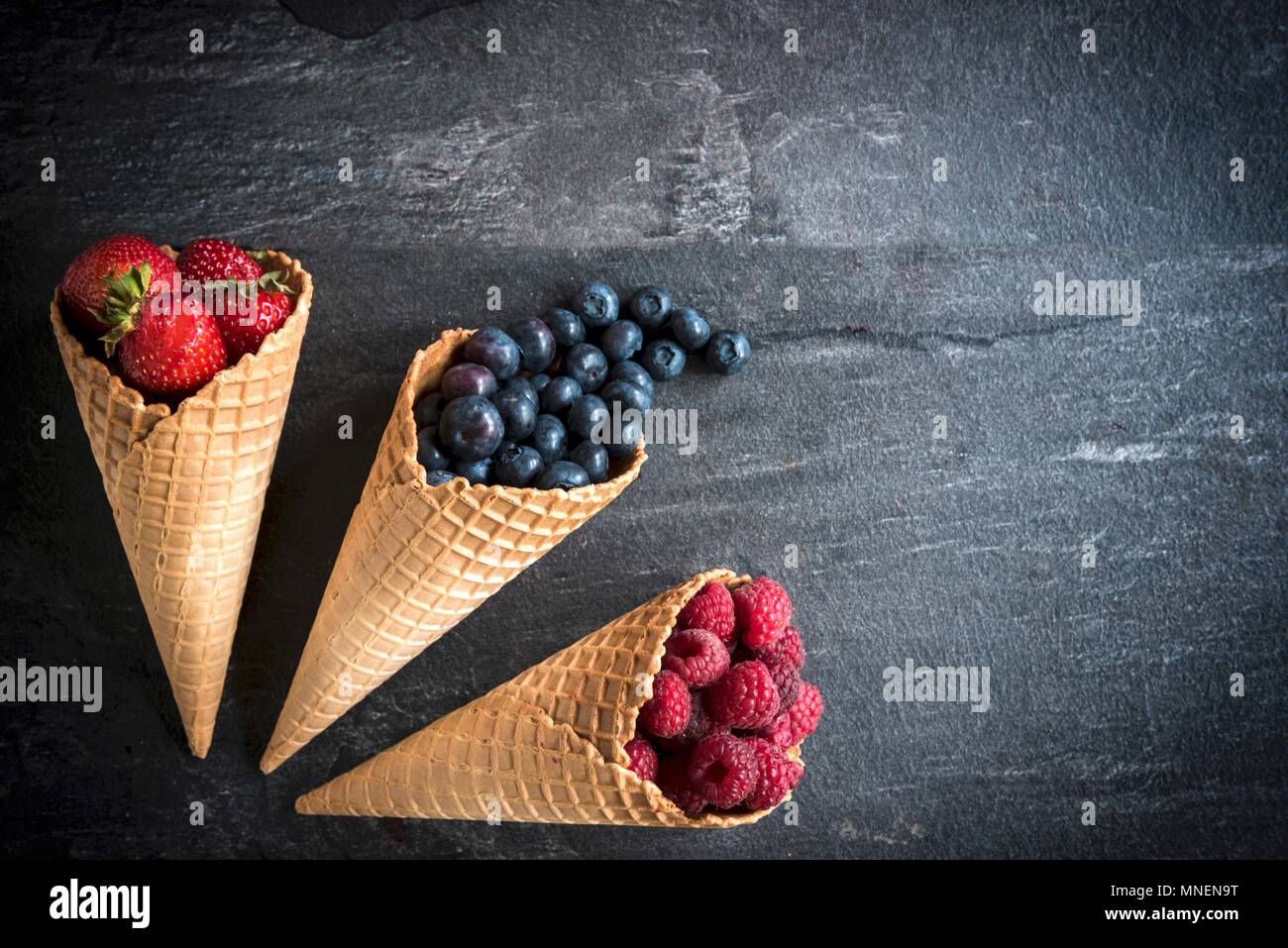 Strawberry ice cream cone ground hi-res stock photography and images ...