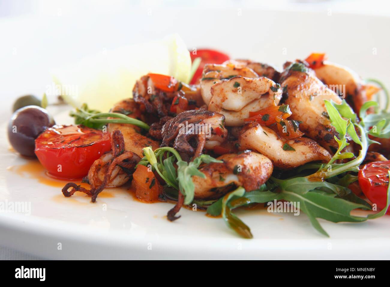 Stir-fried seafood with rocket Stock Photo - Alamy