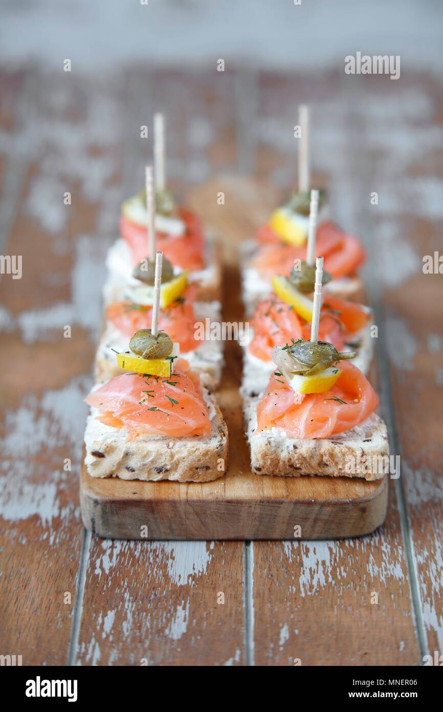 Mini canapés with smoked salmon and capers Stock Photo - Alamy