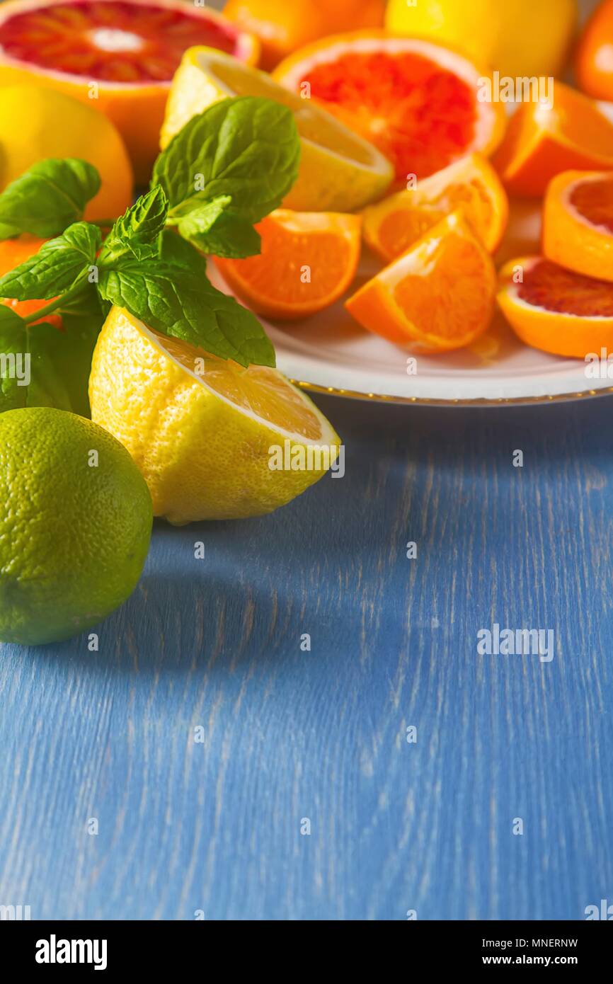 Assorted citrus fruit, whole and halved Stock Photo - Alamy