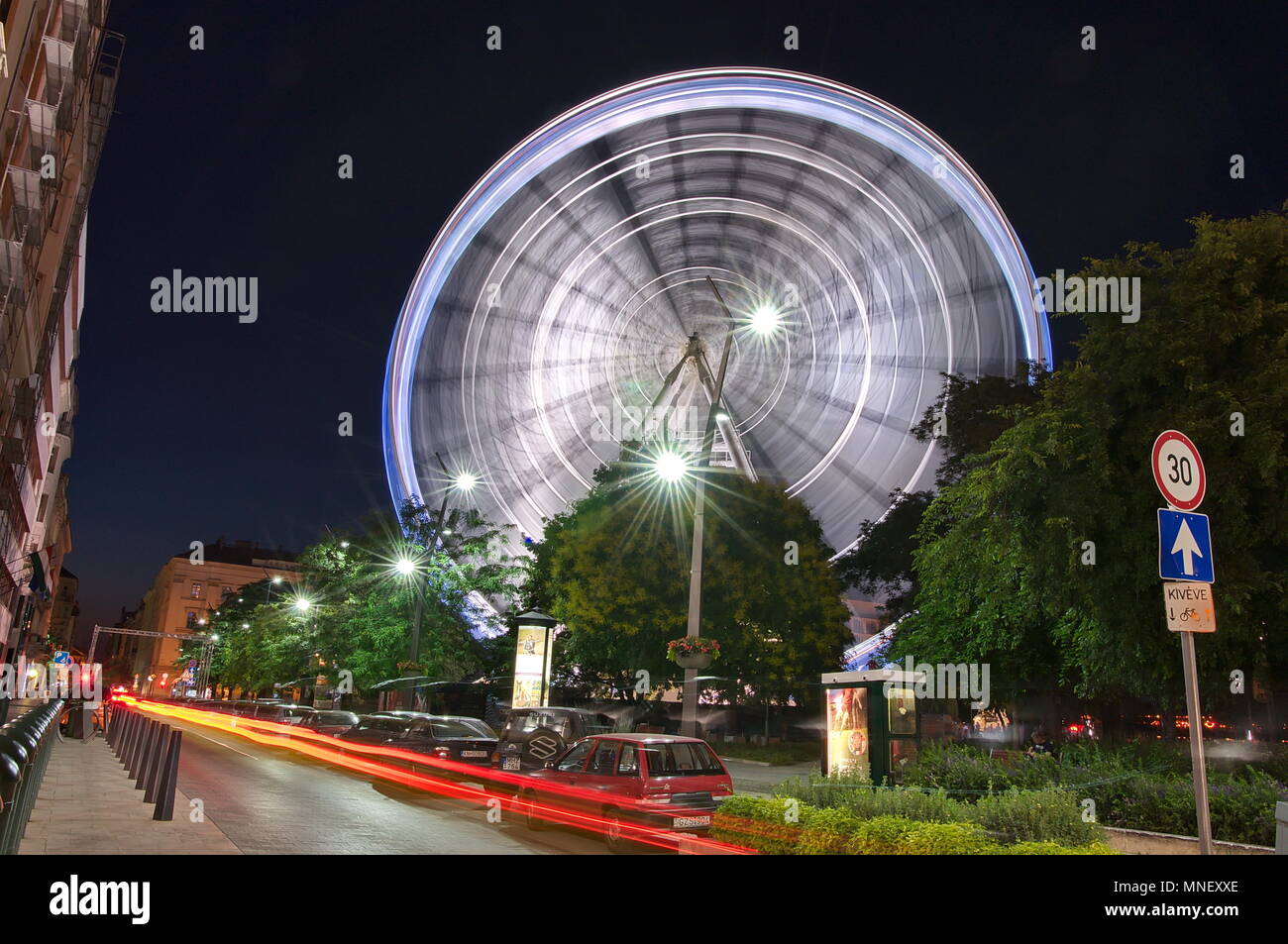 Big wheel spinning at night Stock Photo - Alamy