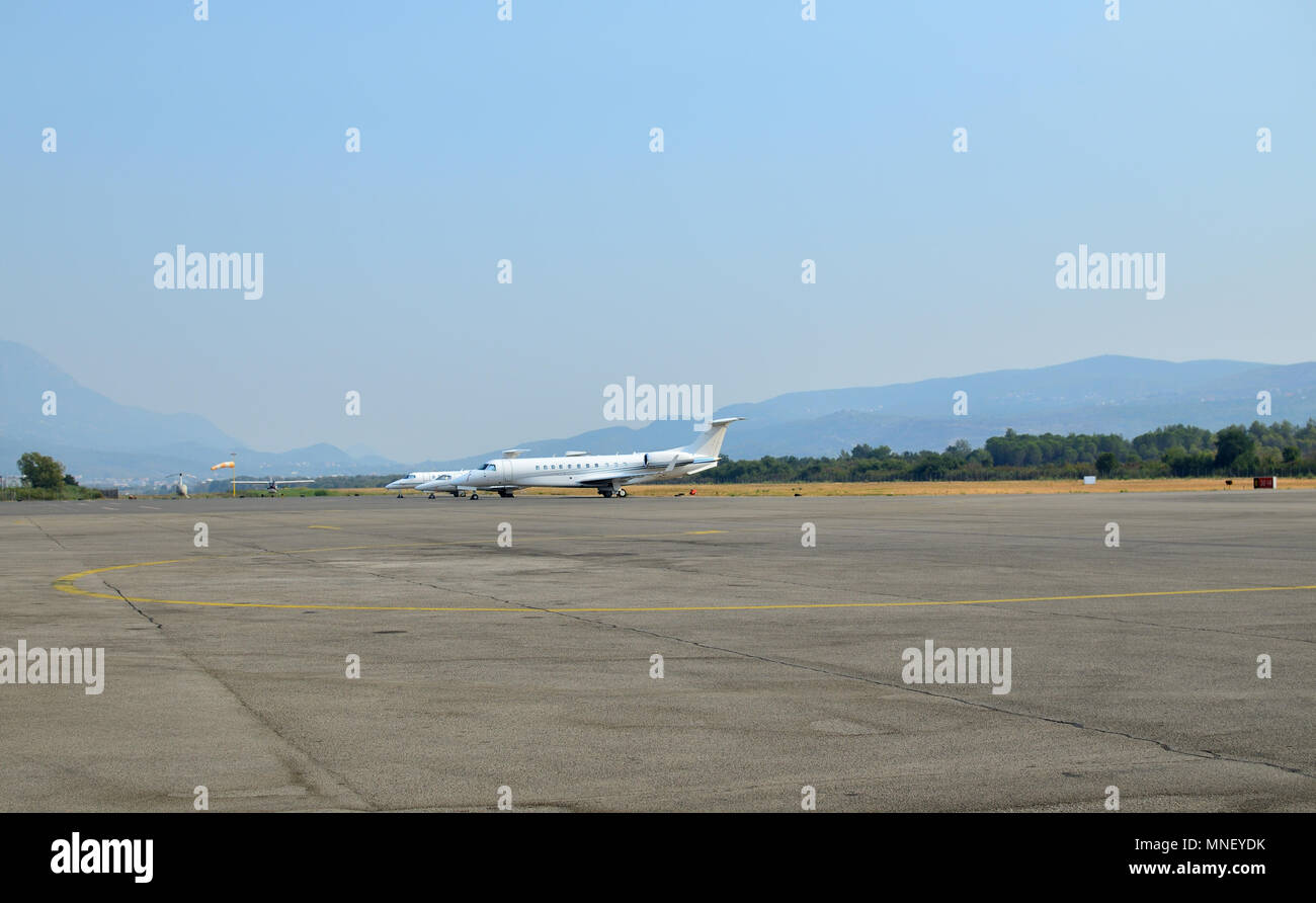 Airplane on an empty runway with a landscape in a background Stock ...