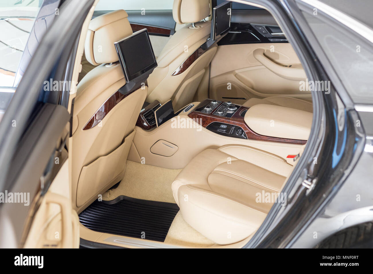 Open back door of business class car. Rear seat of modern luxury ...