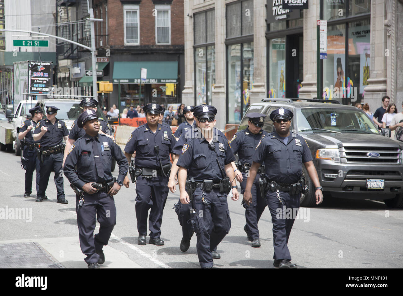Group of New York City Police officers walk down Broadway during the ...