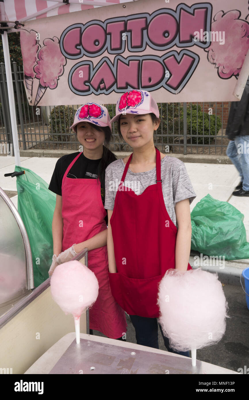 Teenage girls work as cotton candy vendors at a street fair on Church ...