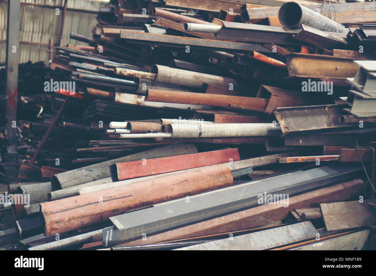 Stack of steel pipes in metal factory shop Stock Photo - Alamy