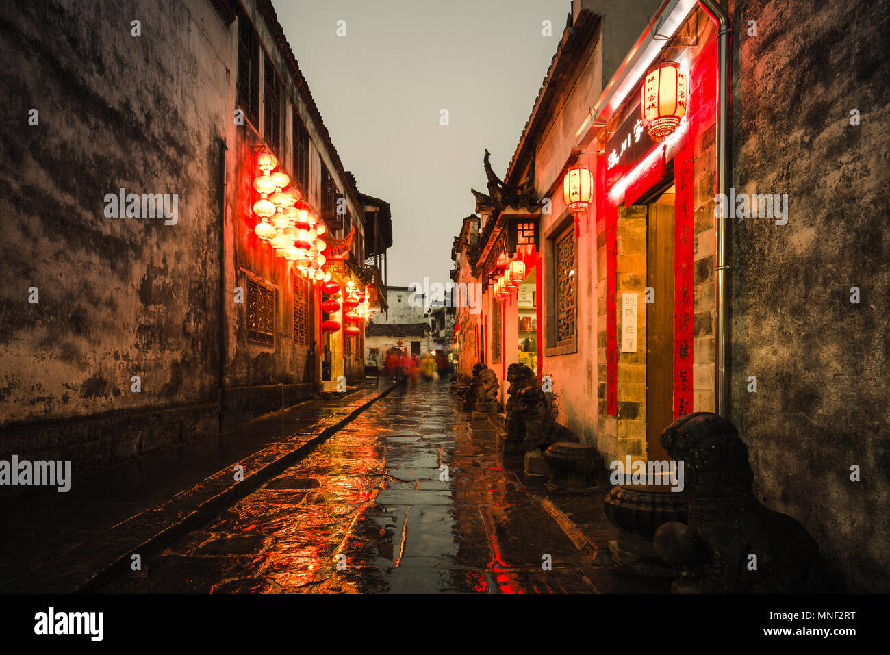 Street with red lanterns in the night Stock Photo - Alamy