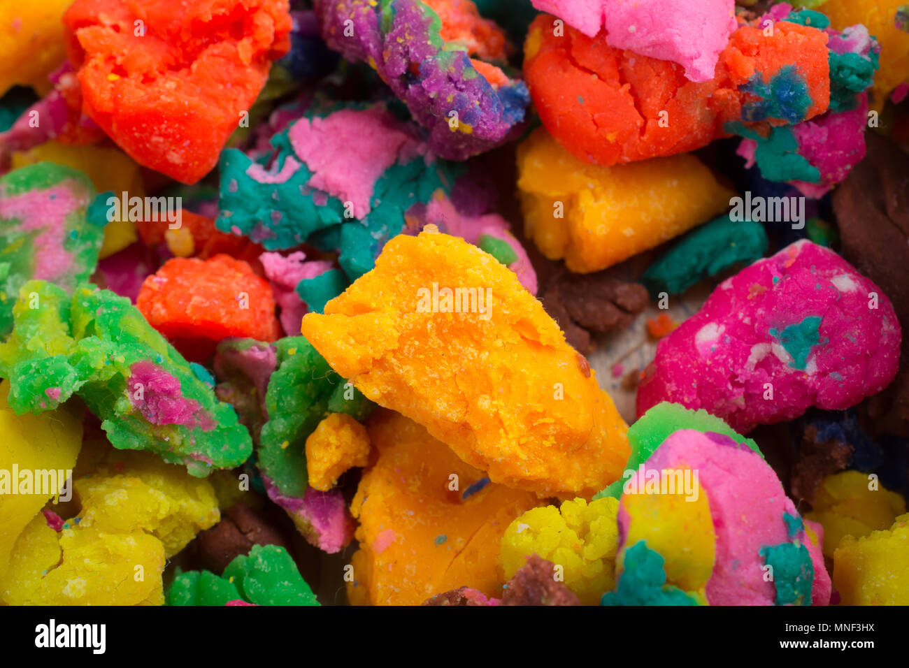 Dry colorful play dough in smal pieces Stock Photo - Alamy