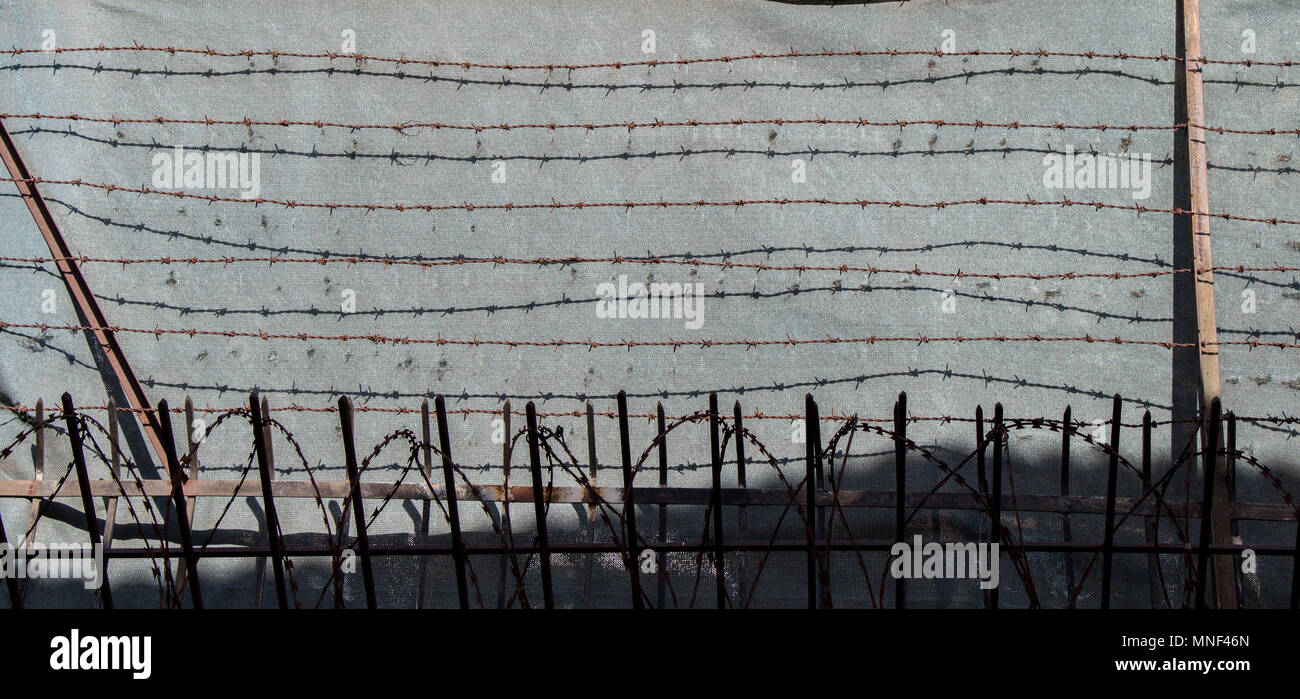 barbed wire fence used for protection purposes Stock Photo - Alamy
